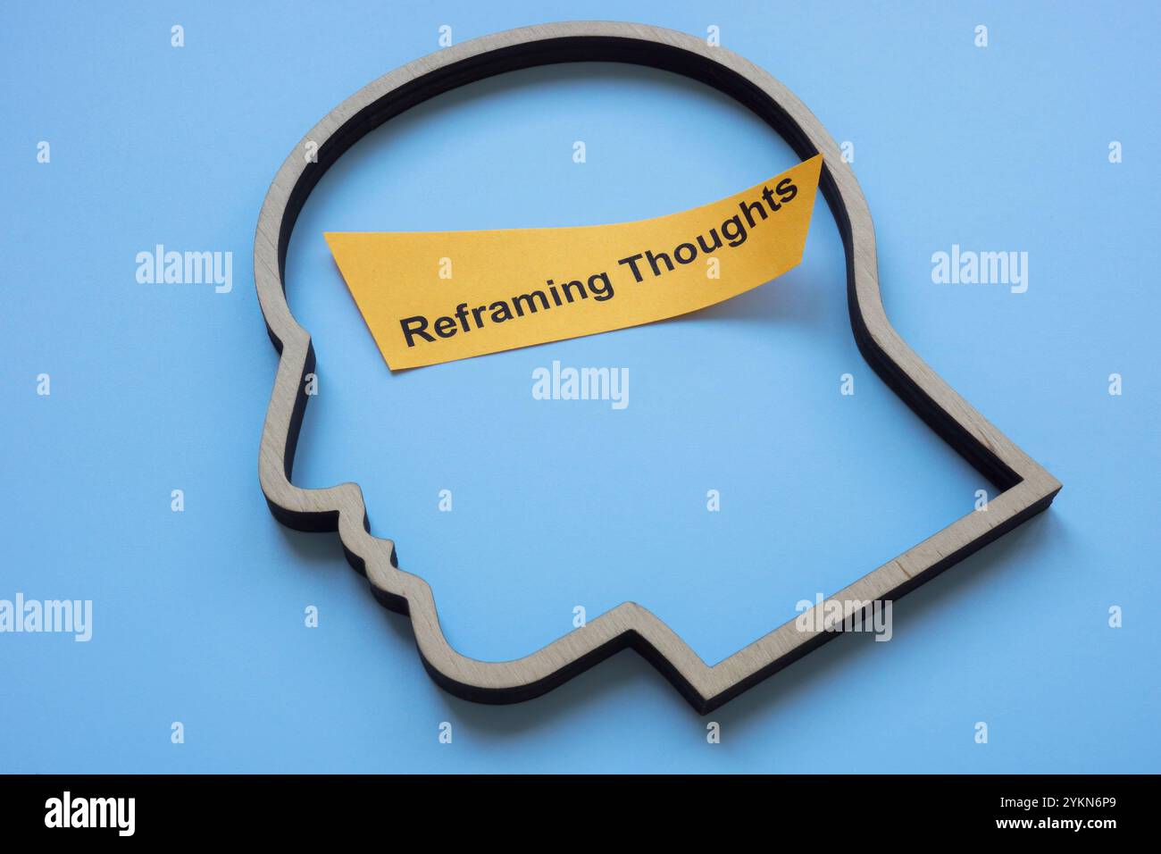 Outline of a head with the phrase reframing thoughts. Mindset shift and ...