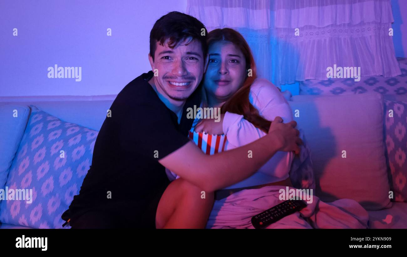 Woman scared hugging man hi-res stock photography and images - Alamy