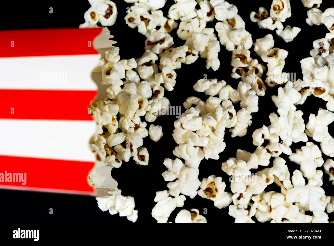 Top view close up of a red and white cardboard bucket lying flat ...