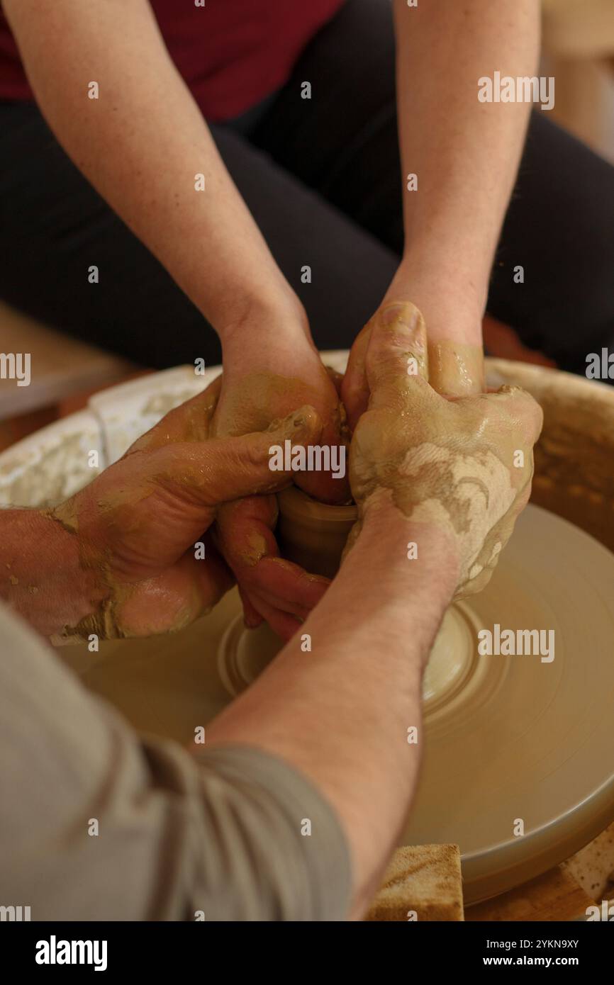 The Art of Pottery: Hands in Harmony Stock Photo - Alamy