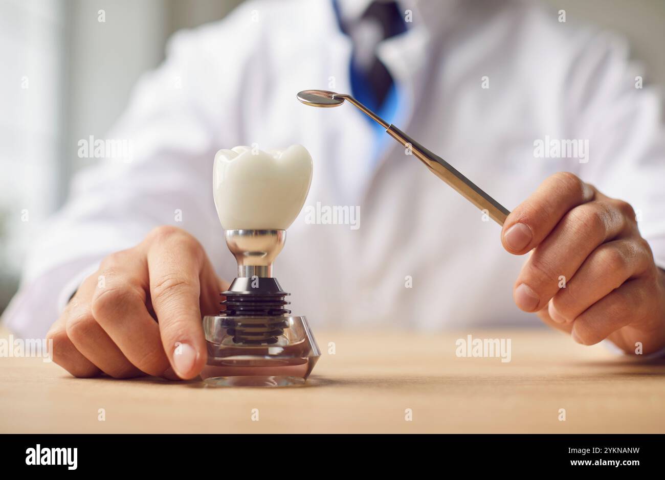 Dentist Using Instrument To Show Tooth Model Stock Photo - Alamy