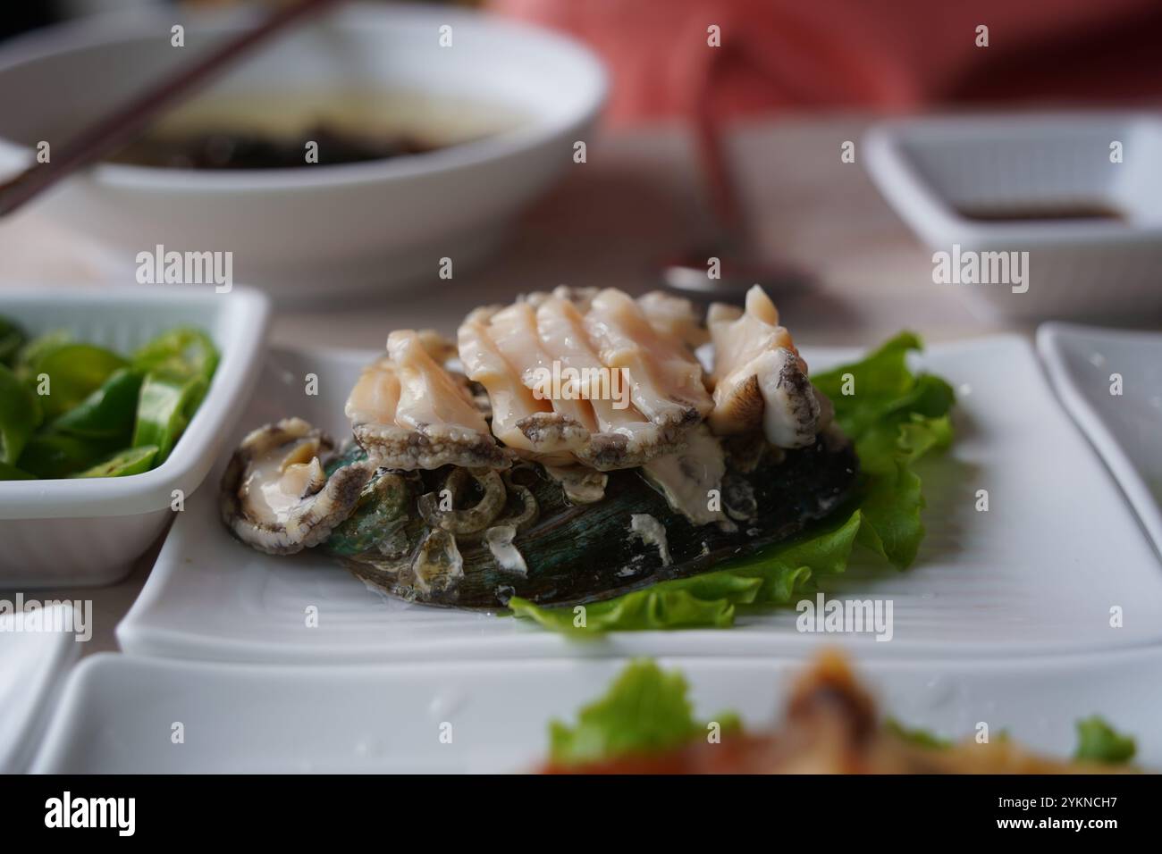 Eat fresh abalone sliced raw Stock Photo - Alamy
