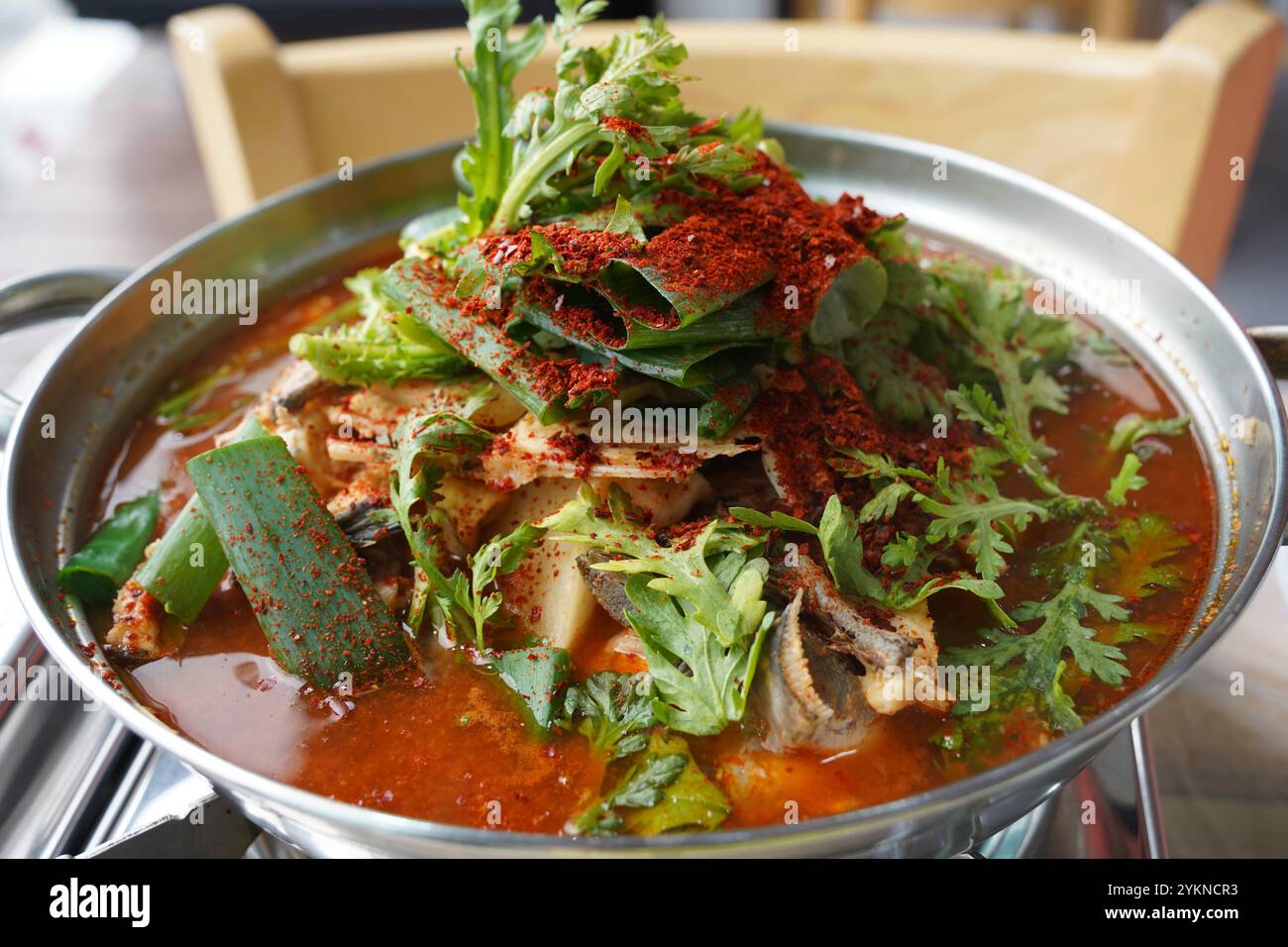korean spicy stew made by boiling fish and vegetables with red pepper ...