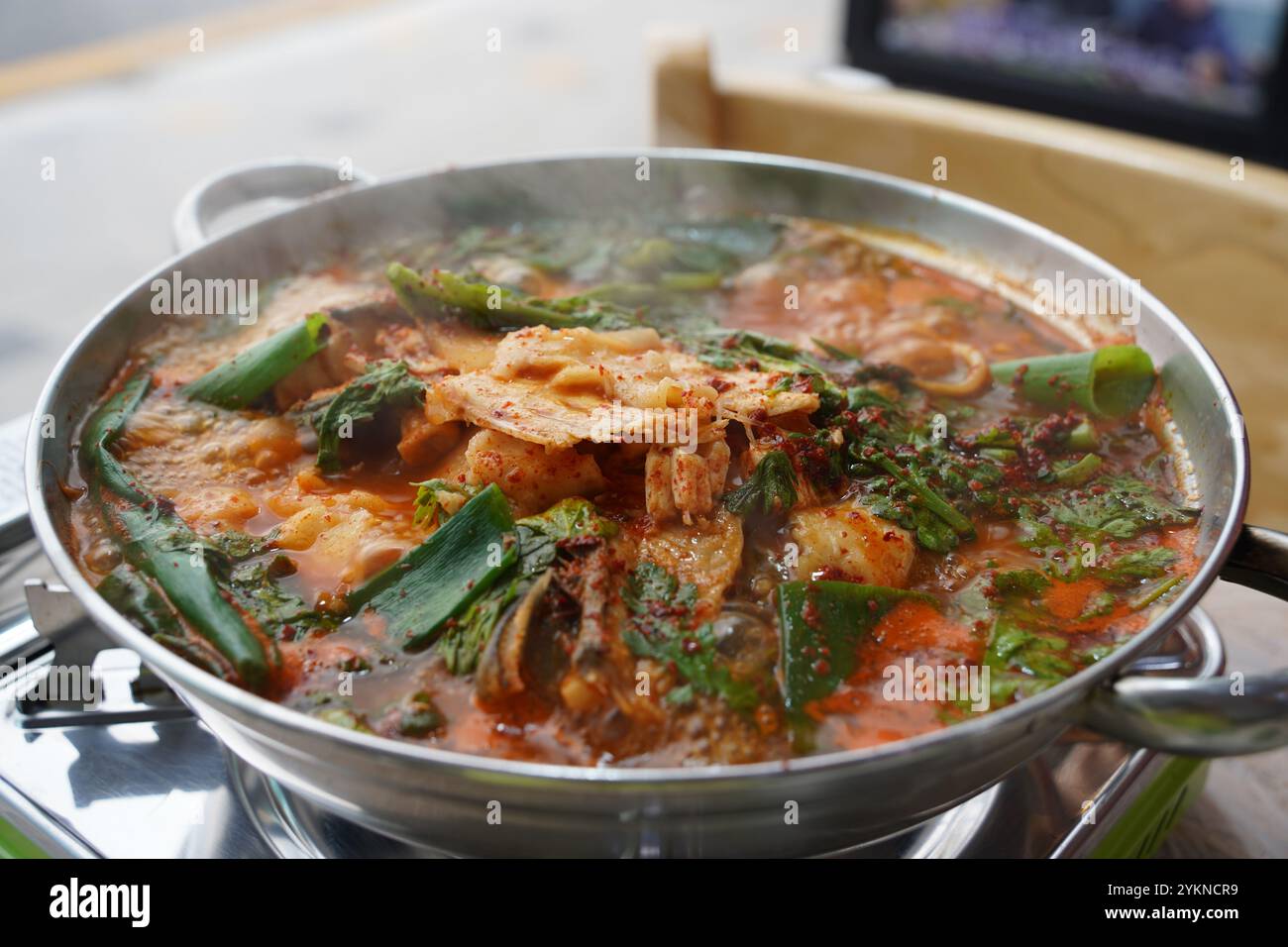korean spicy stew made by boiling fish and vegetables with red pepper ...