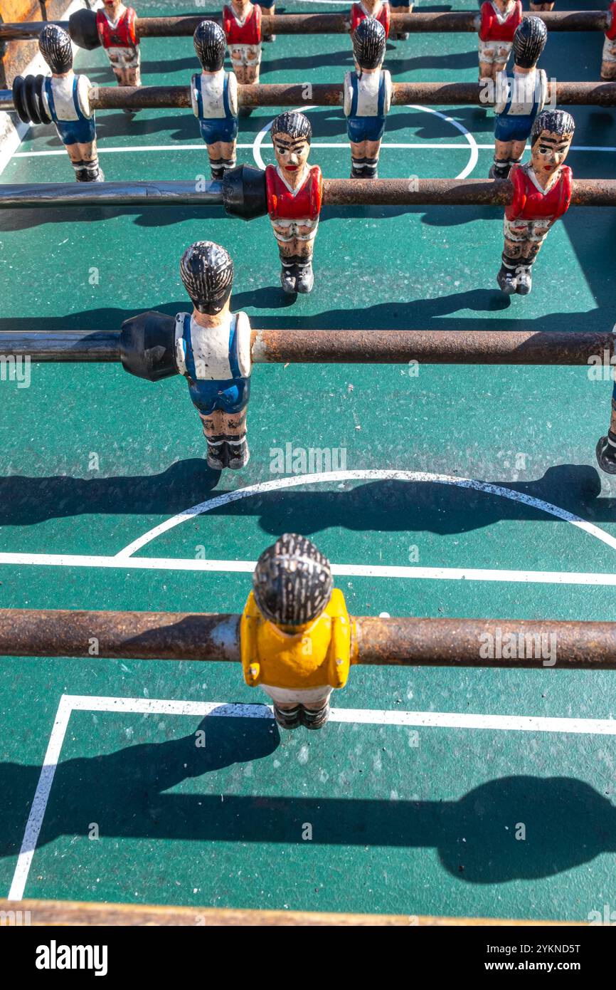 A close-up of the table football game of football figures on the field ...