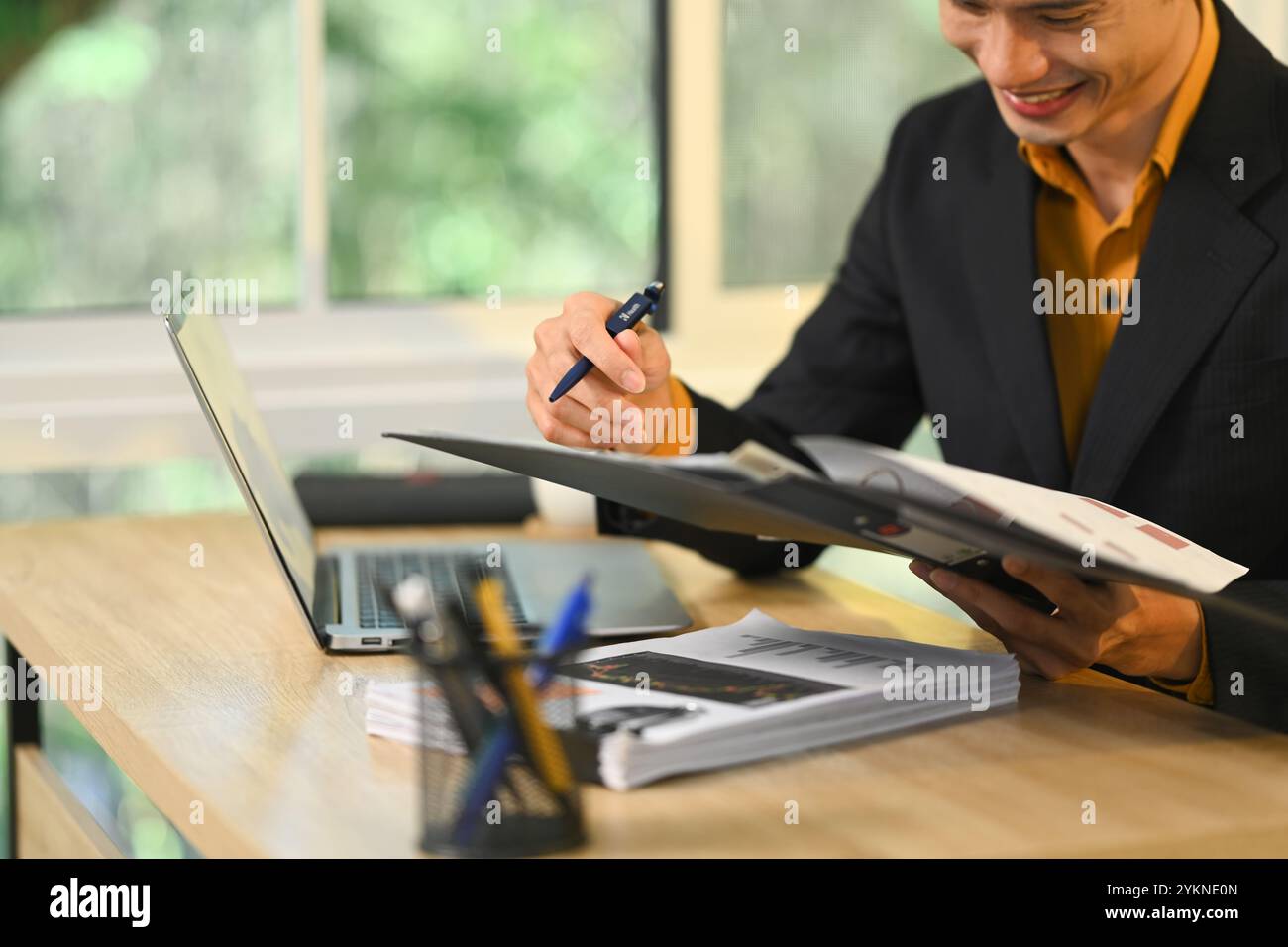 Businessman accountant reviewing paperwork using hi-res stock ...
