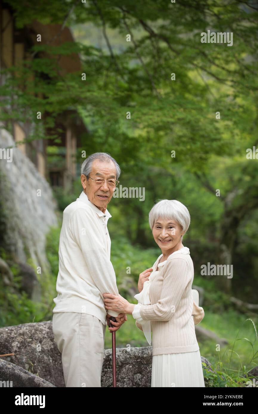 Senior couple bathing in forest Stock Photo - Alamy