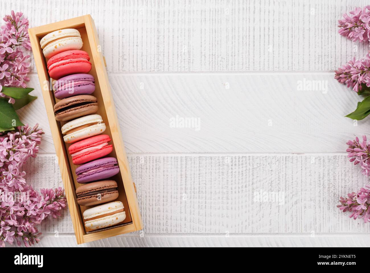Colorful macaroons in box, arranged in a delightful display of vibrant ...