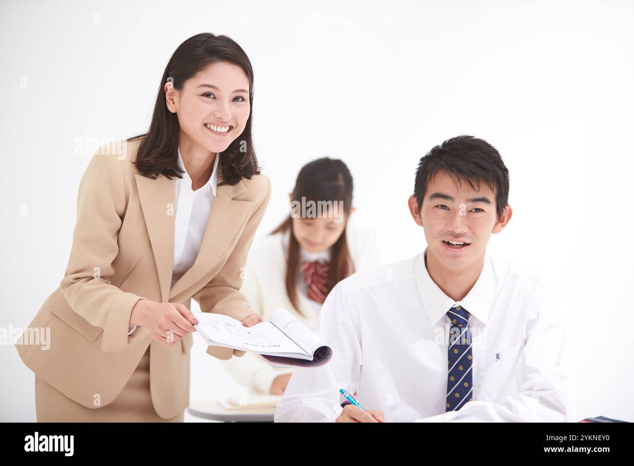 Female teacher and male and female high school pupils in class Stock ...