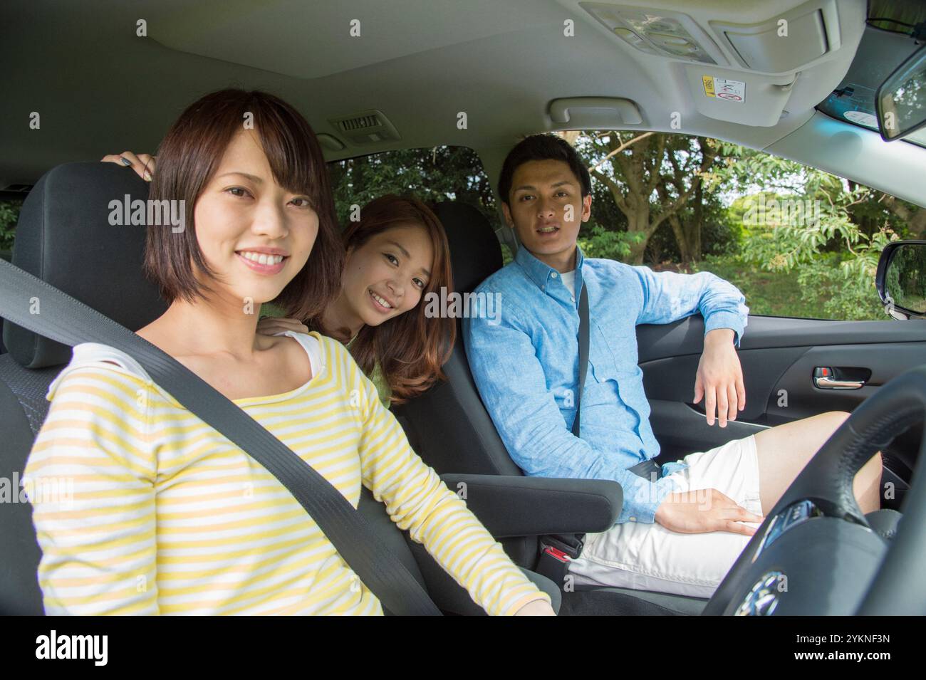 Three young people in car Stock Photo - Alamy
