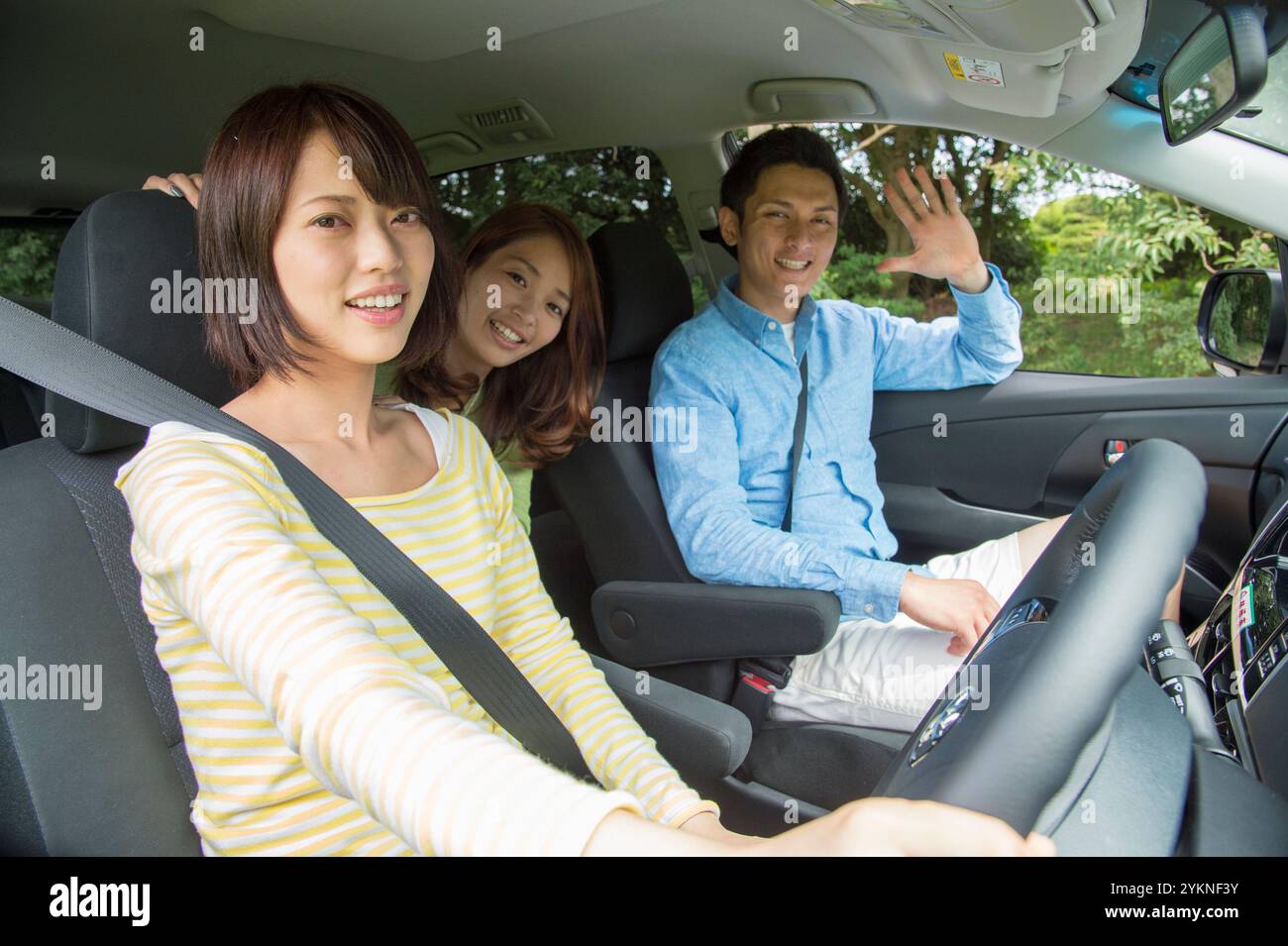 Three young people in car Stock Photo - Alamy