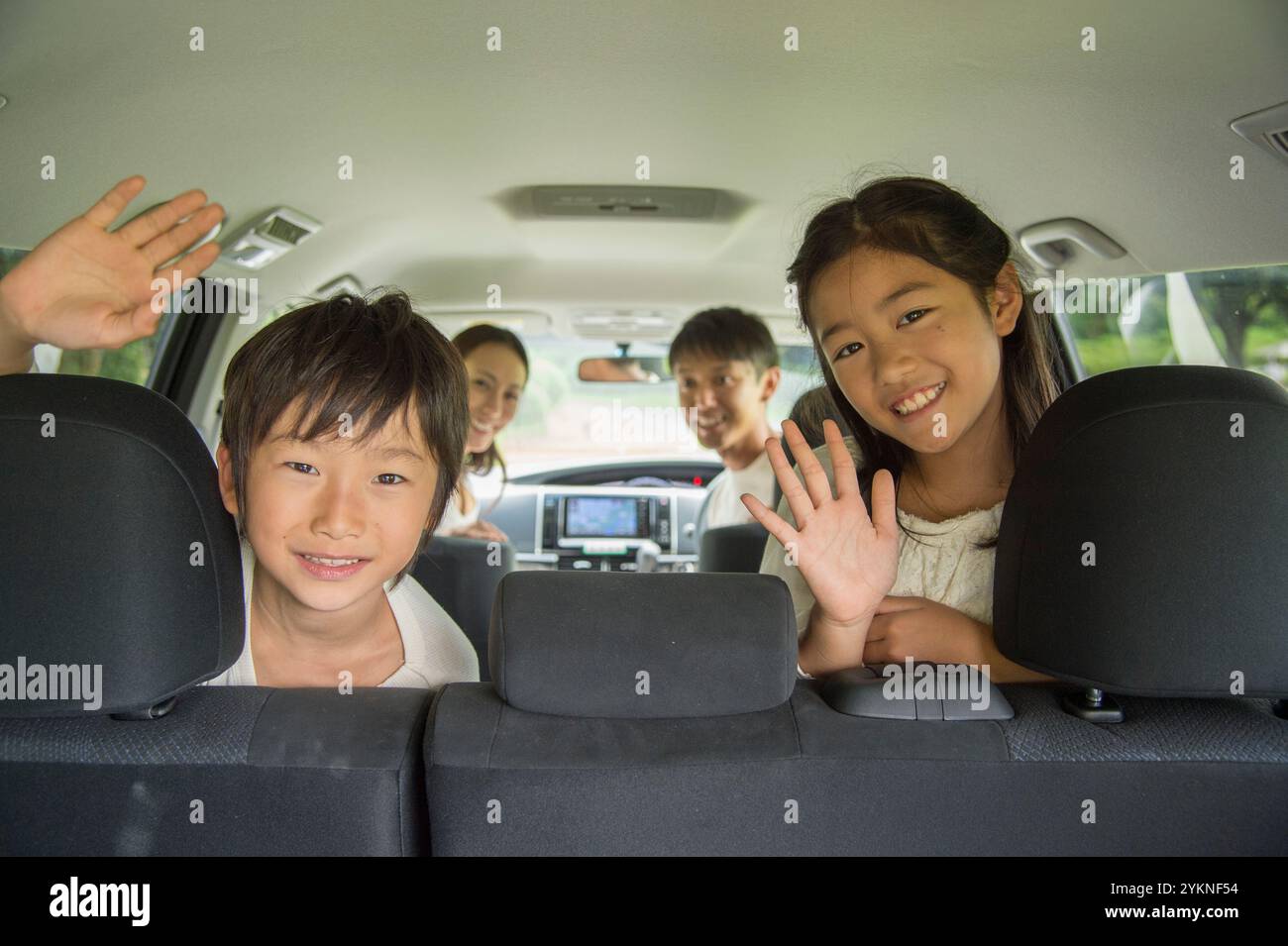 Family in car Stock Photo - Alamy