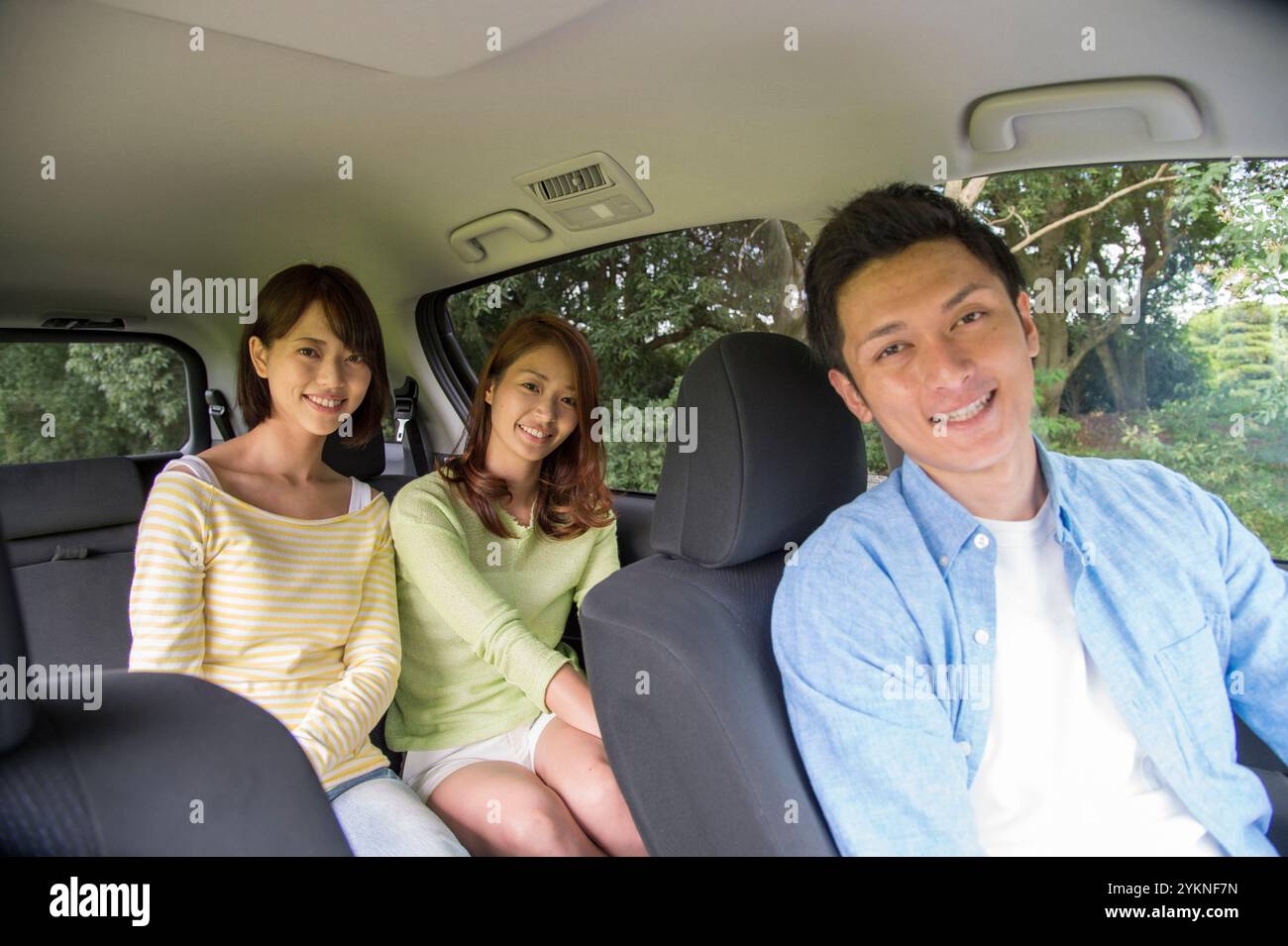 Three young people in car Stock Photo - Alamy
