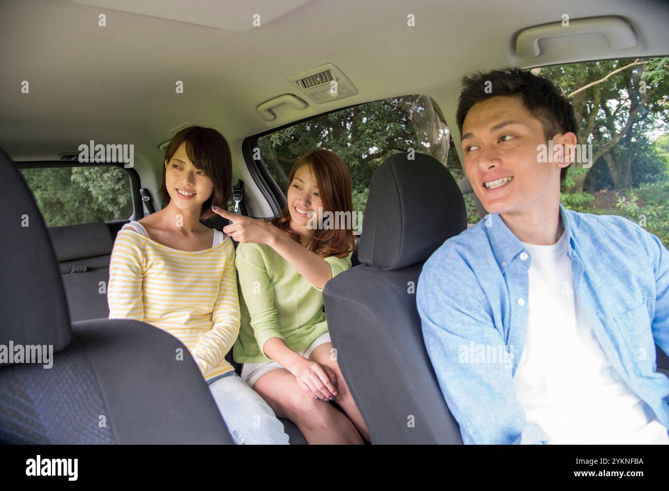 Three young people in car Stock Photo - Alamy