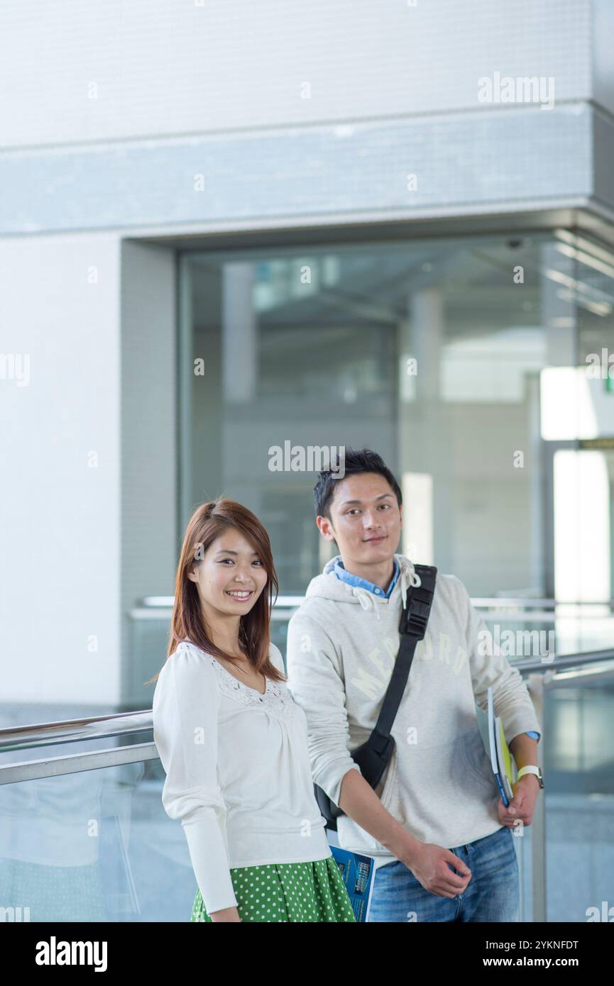 University student couple in school building Stock Photo - Alamy