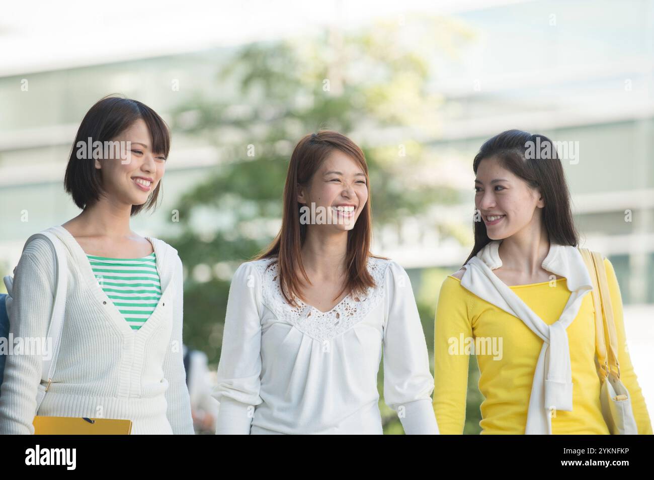 Three female university students walking on campus Stock Photo - Alamy