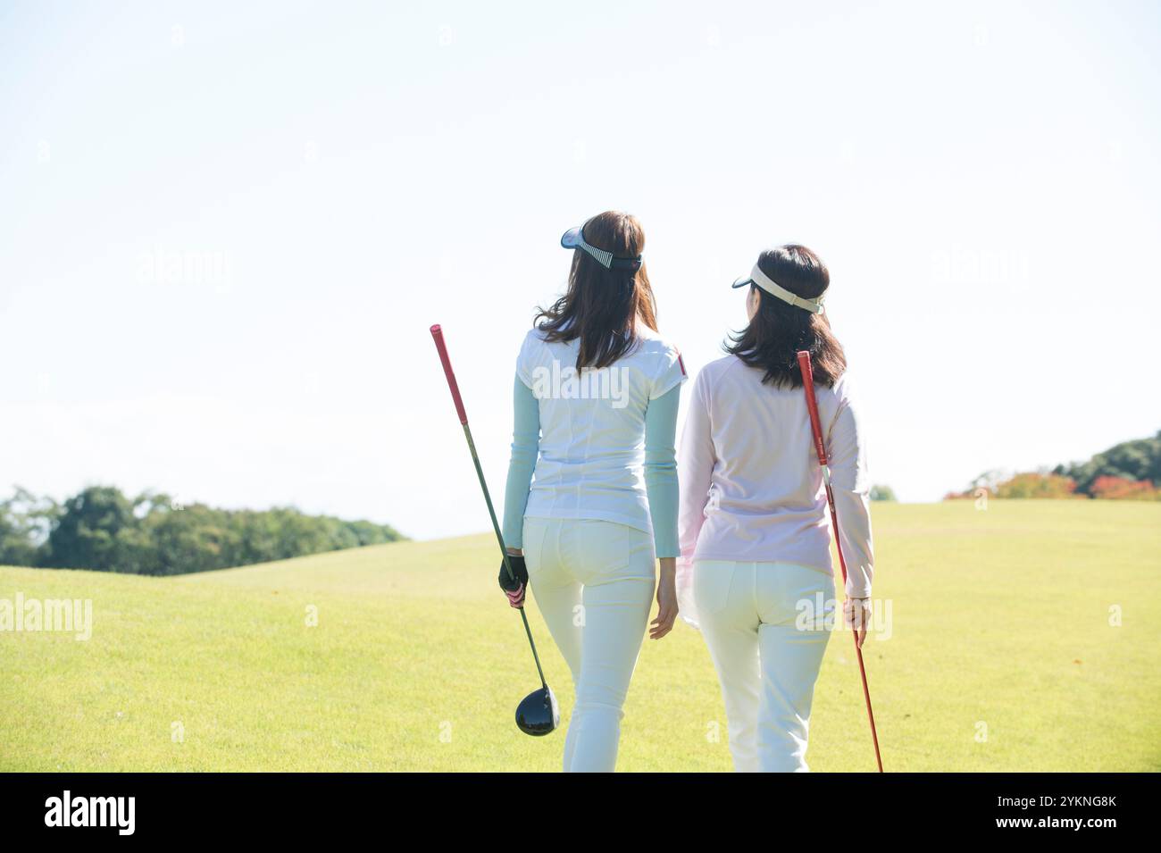 Mother and daughter playing golf Stock Photo - Alamy