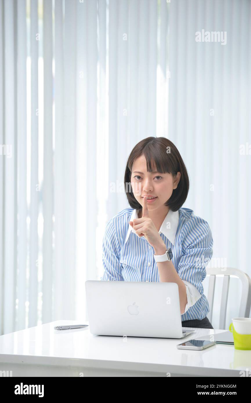 Office worker giving index finger Stock Photo - Alamy