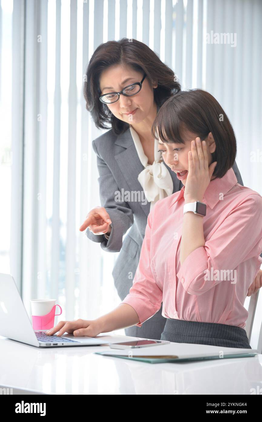 Two office workers, boss and subordinate, scolding each other for ...