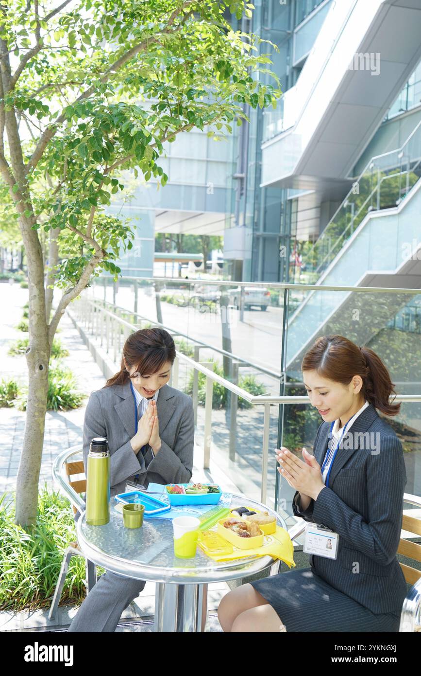 Happy office workers sit in hi-res stock photography and images - Alamy