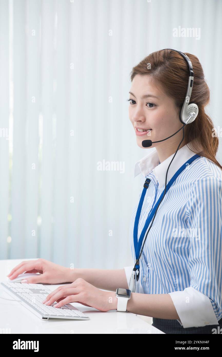 Office worker wearing an intercom Stock Photo - Alamy