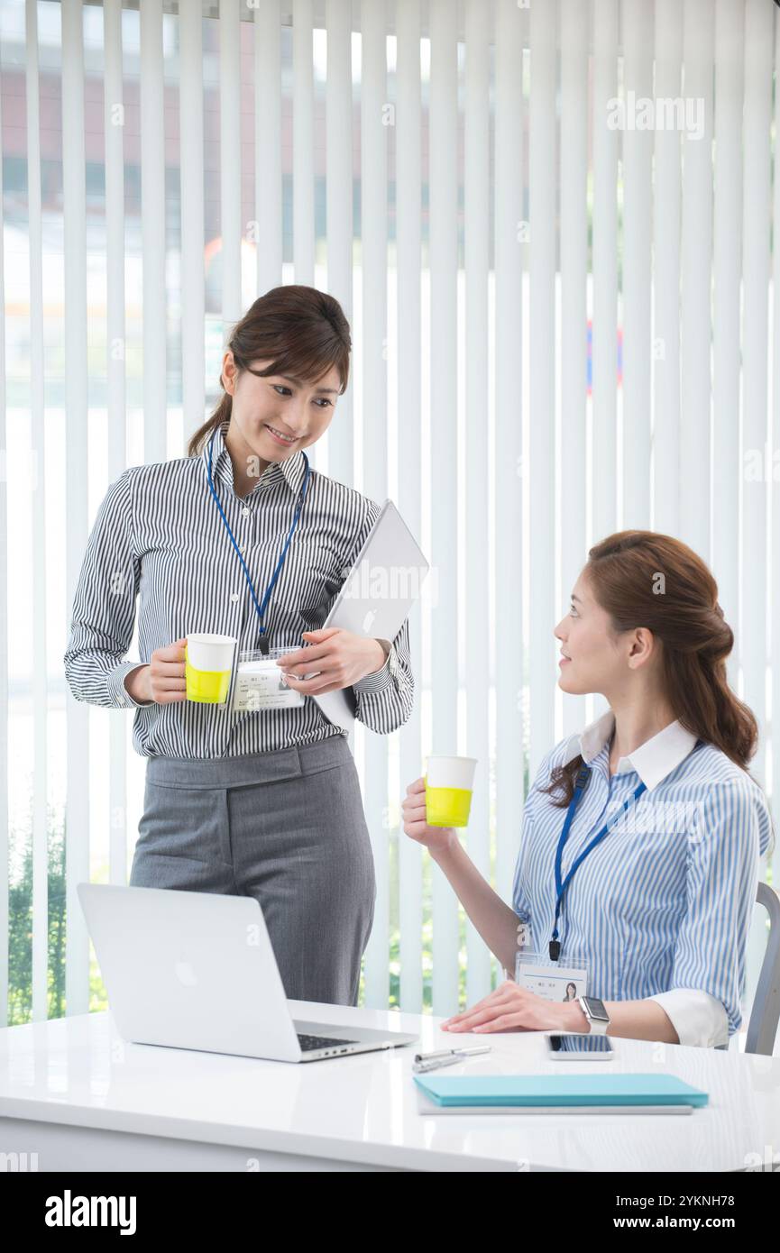 Two office workers at break time Stock Photo - Alamy