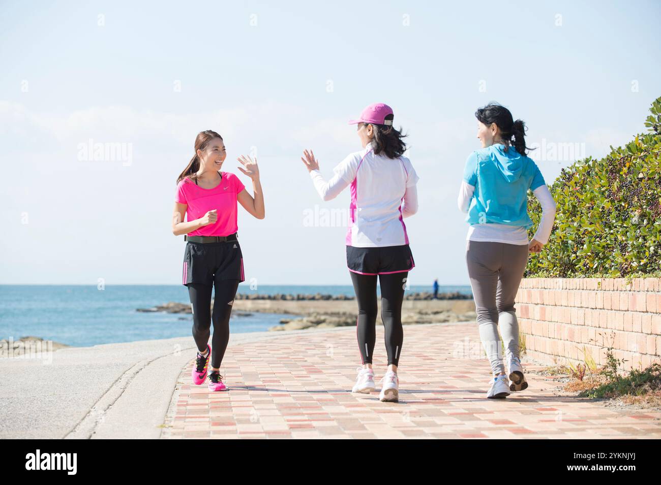 Three women running on hi-res stock photography and images - Alamy