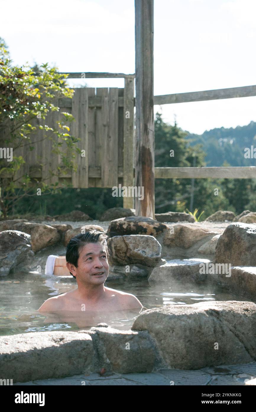Middle-aged man in open-air bath Stock Photo - Alamy
