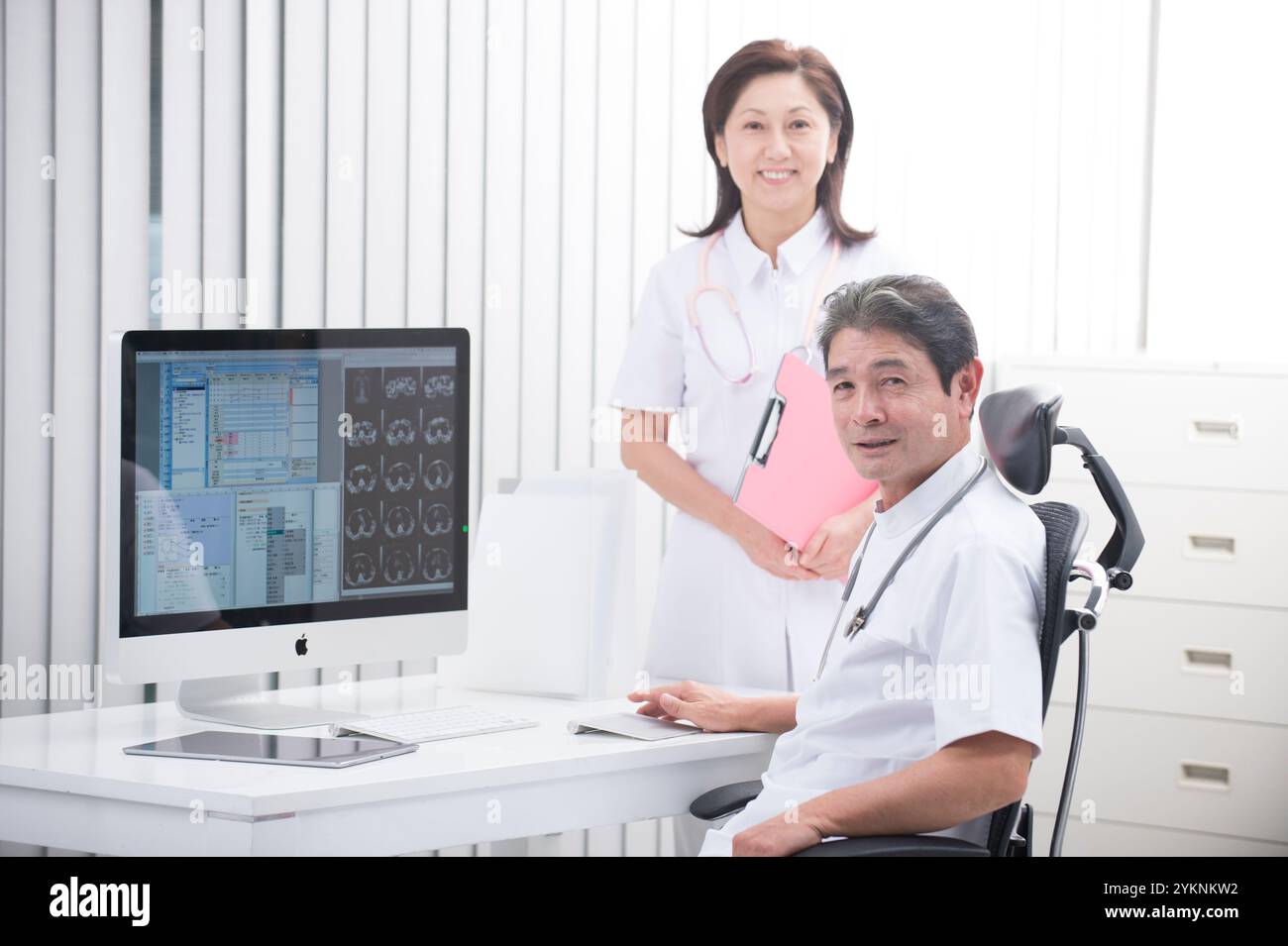 Doctor and nurse in examination room Stock Photo - Alamy