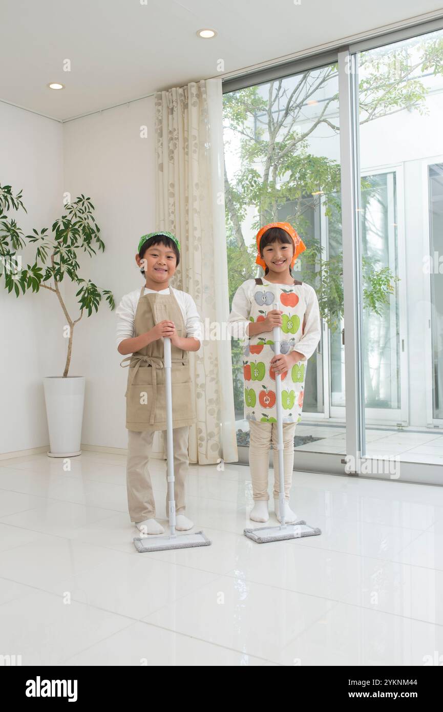 Male and female children cleaning Stock Photo - Alamy
