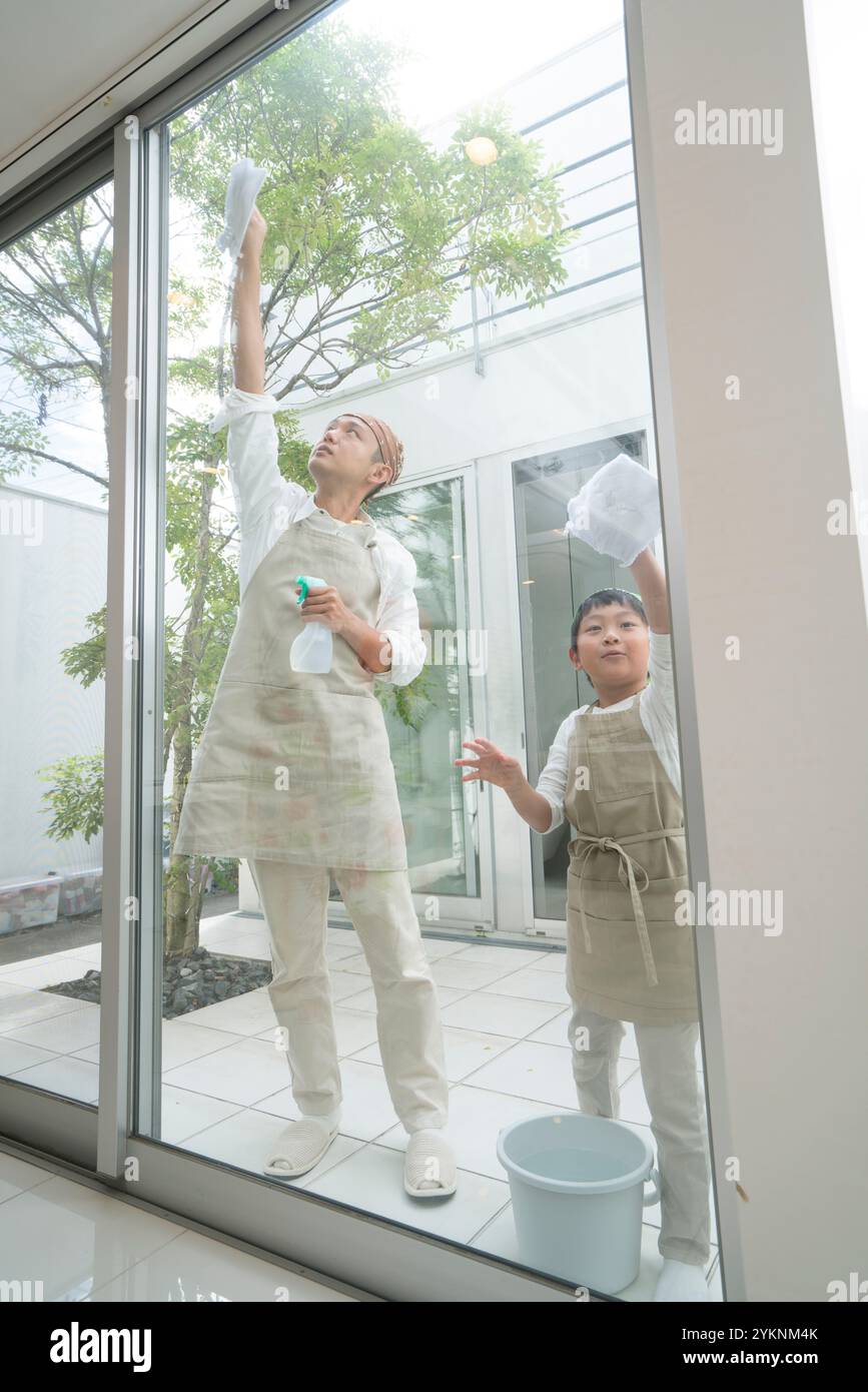 Boy child cleaning window hi-res stock photography and images - Alamy