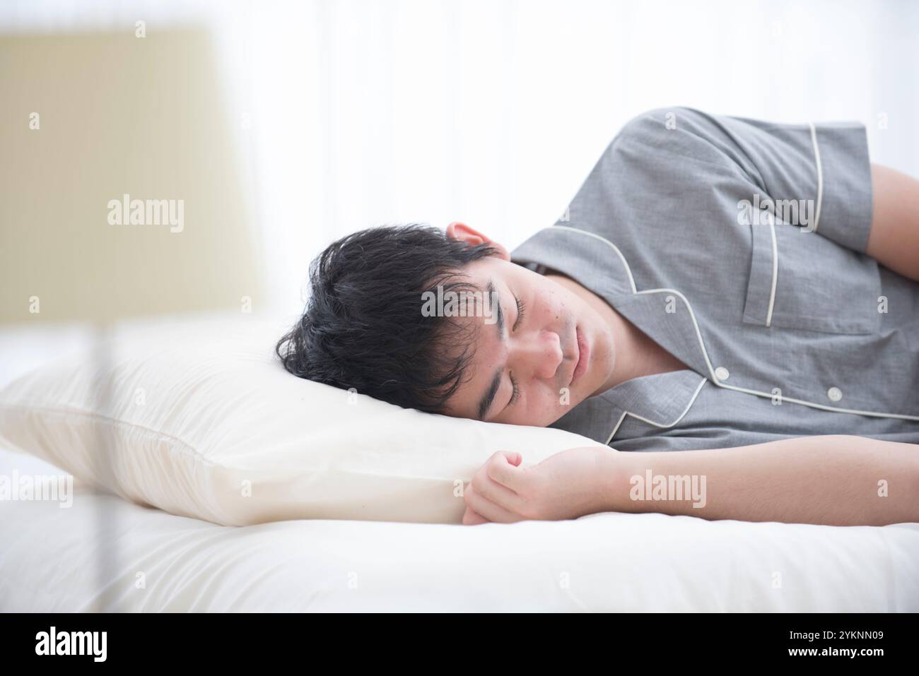 Men sleeping in bed Stock Photo - Alamy