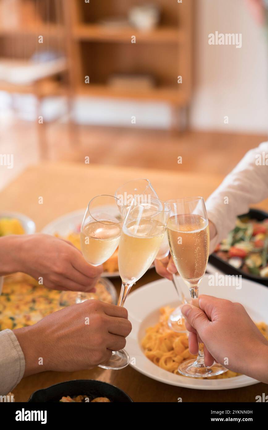 Four people hands toasting hi-res stock photography and images - Alamy