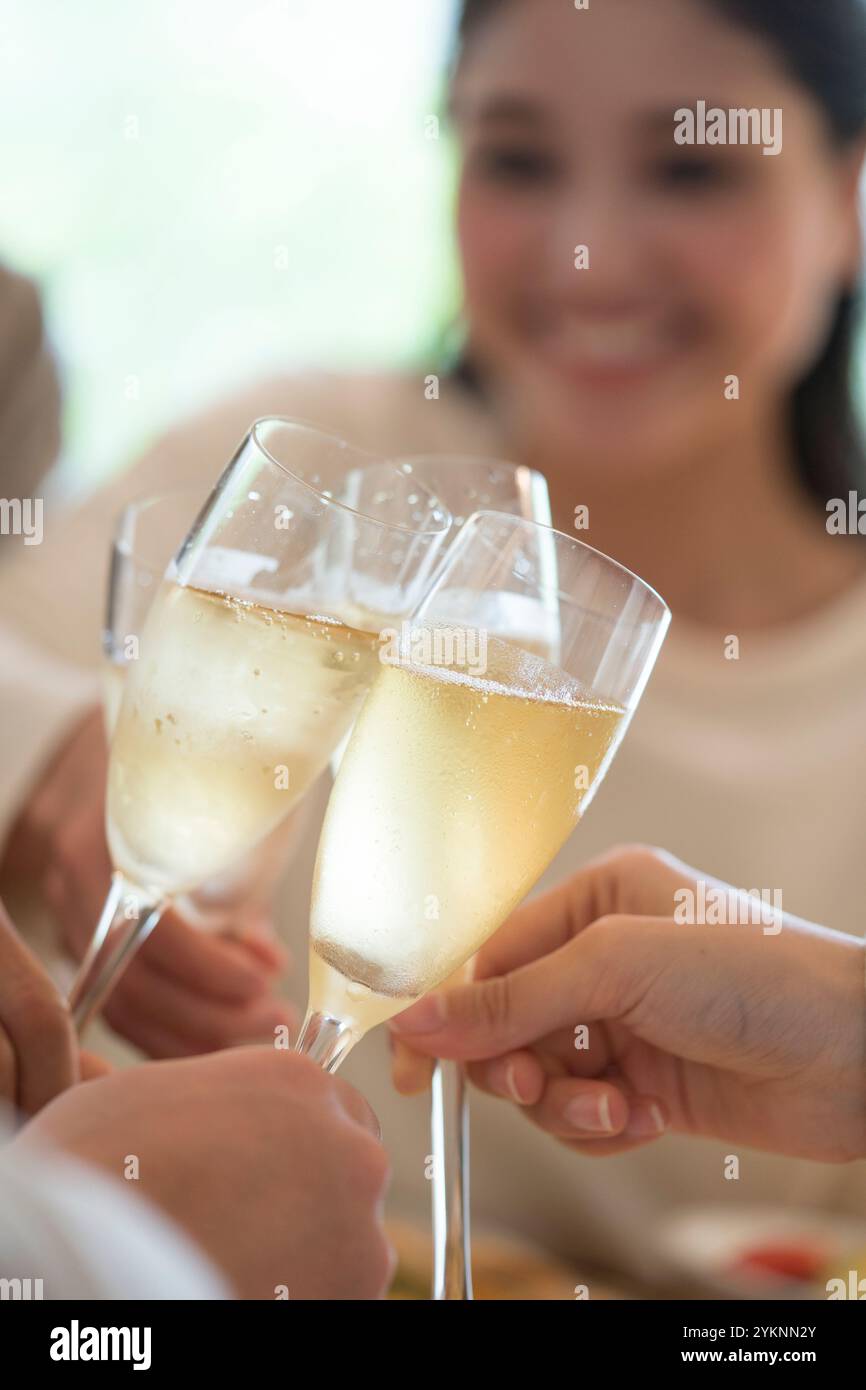 Four people hands toasting hi-res stock photography and images - Alamy