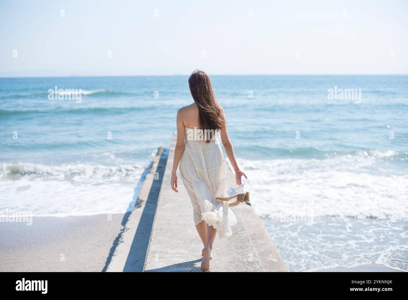 Woman walking outdoors on sea hi-res stock photography and images - Alamy