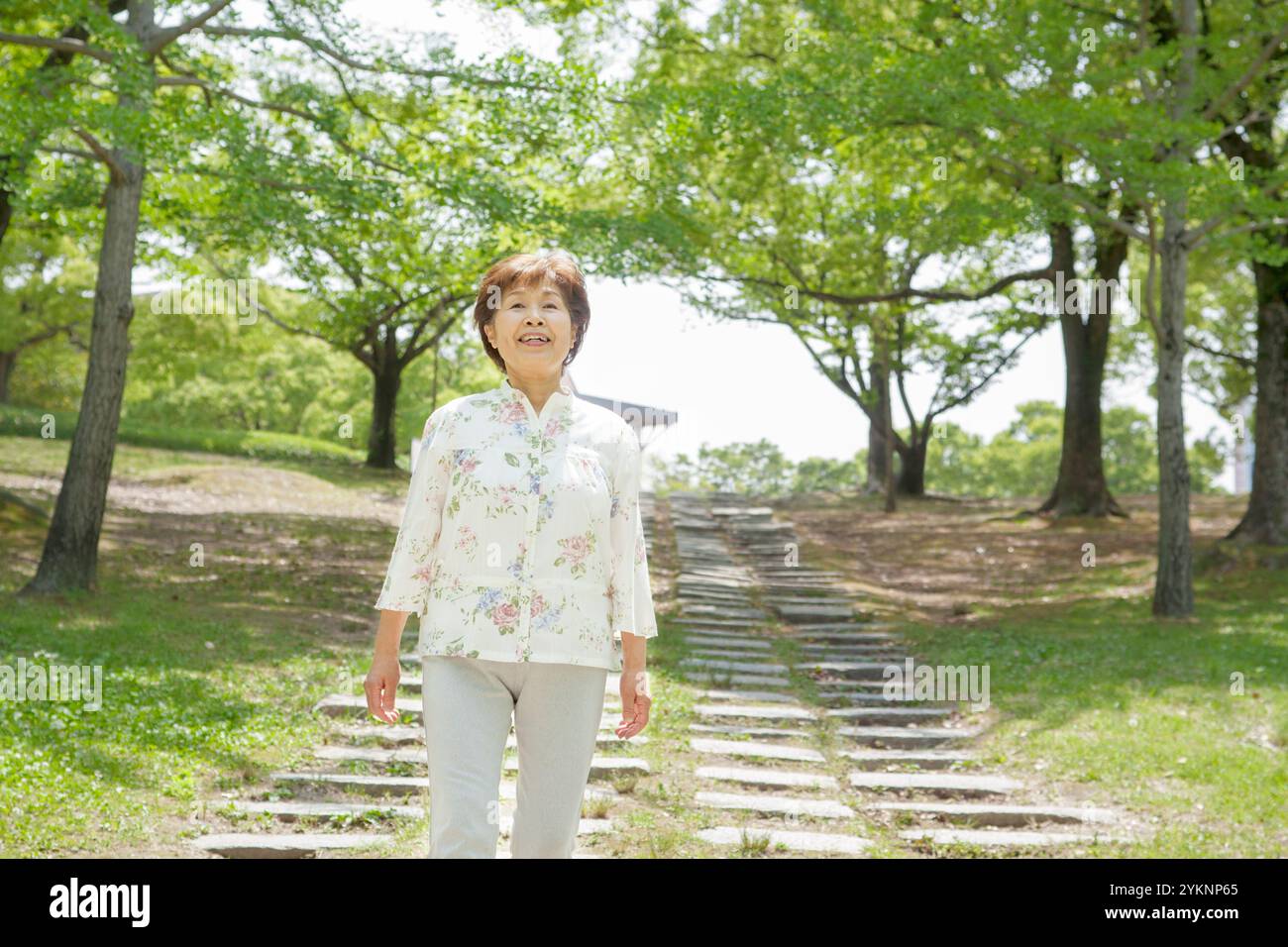 Senior woman in 60s walking hi-res stock photography and images - Alamy