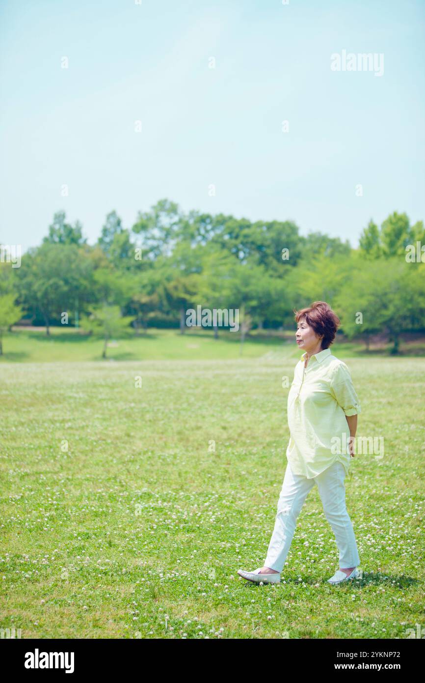 Woman walking early in hi-res stock photography and images - Alamy