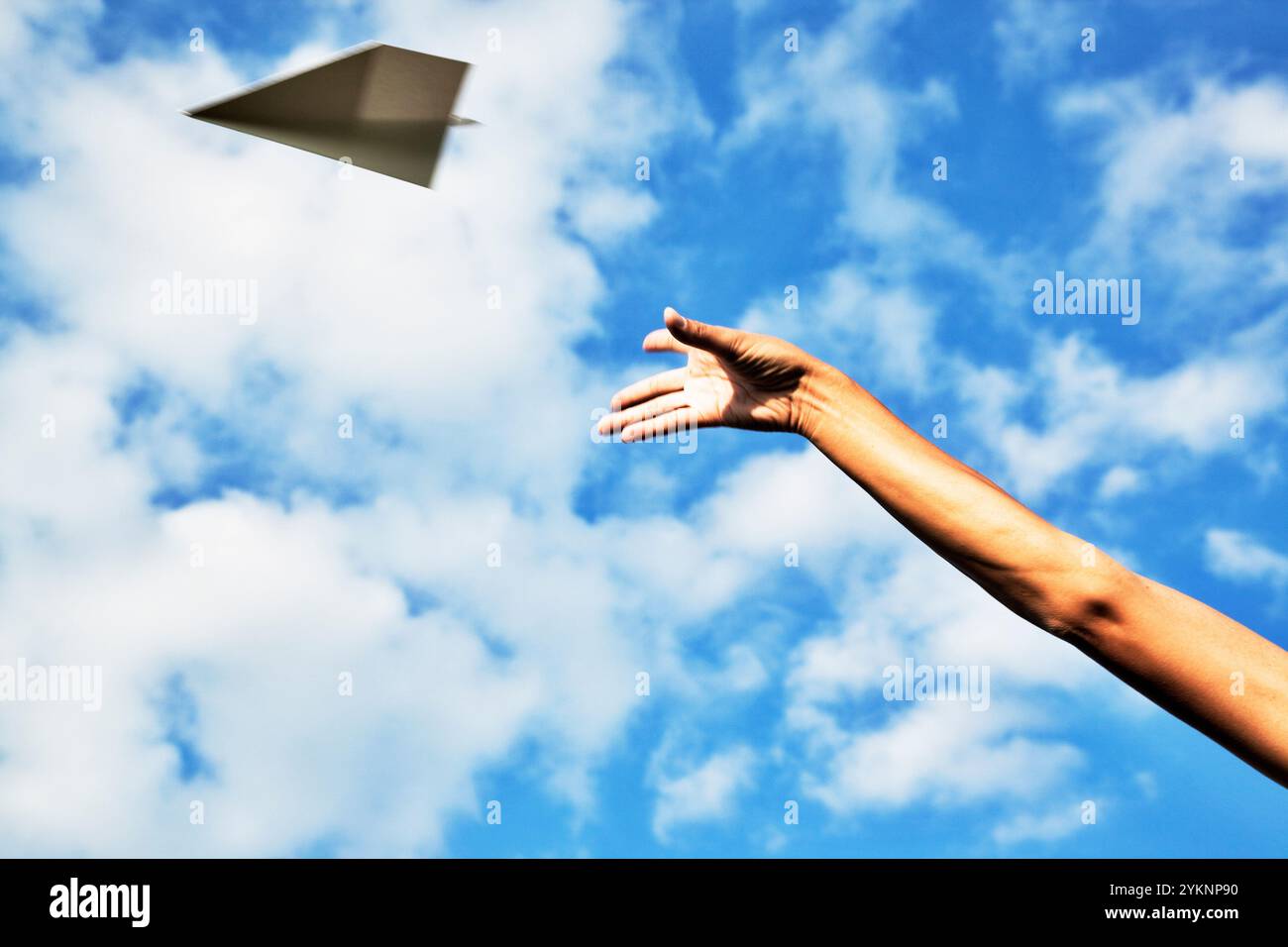 Blue sky, paper plane and hand Stock Photo - Alamy