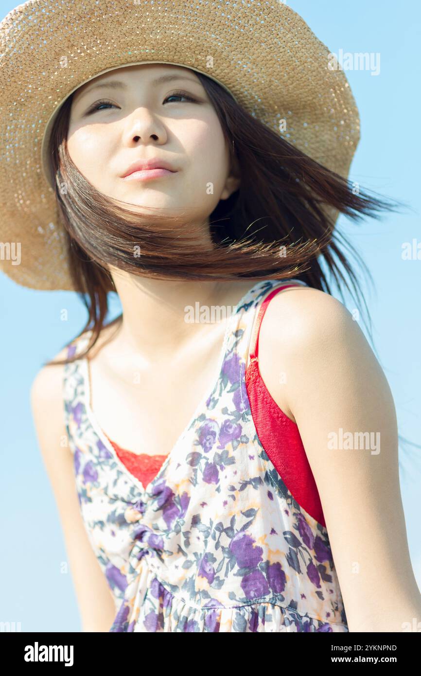 Japanese woman with straw hat Stock Photo - Alamy