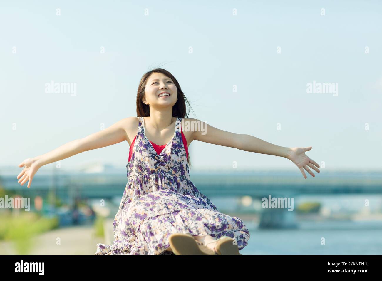 Japanese woman smiling with open arms Stock Photo - Alamy