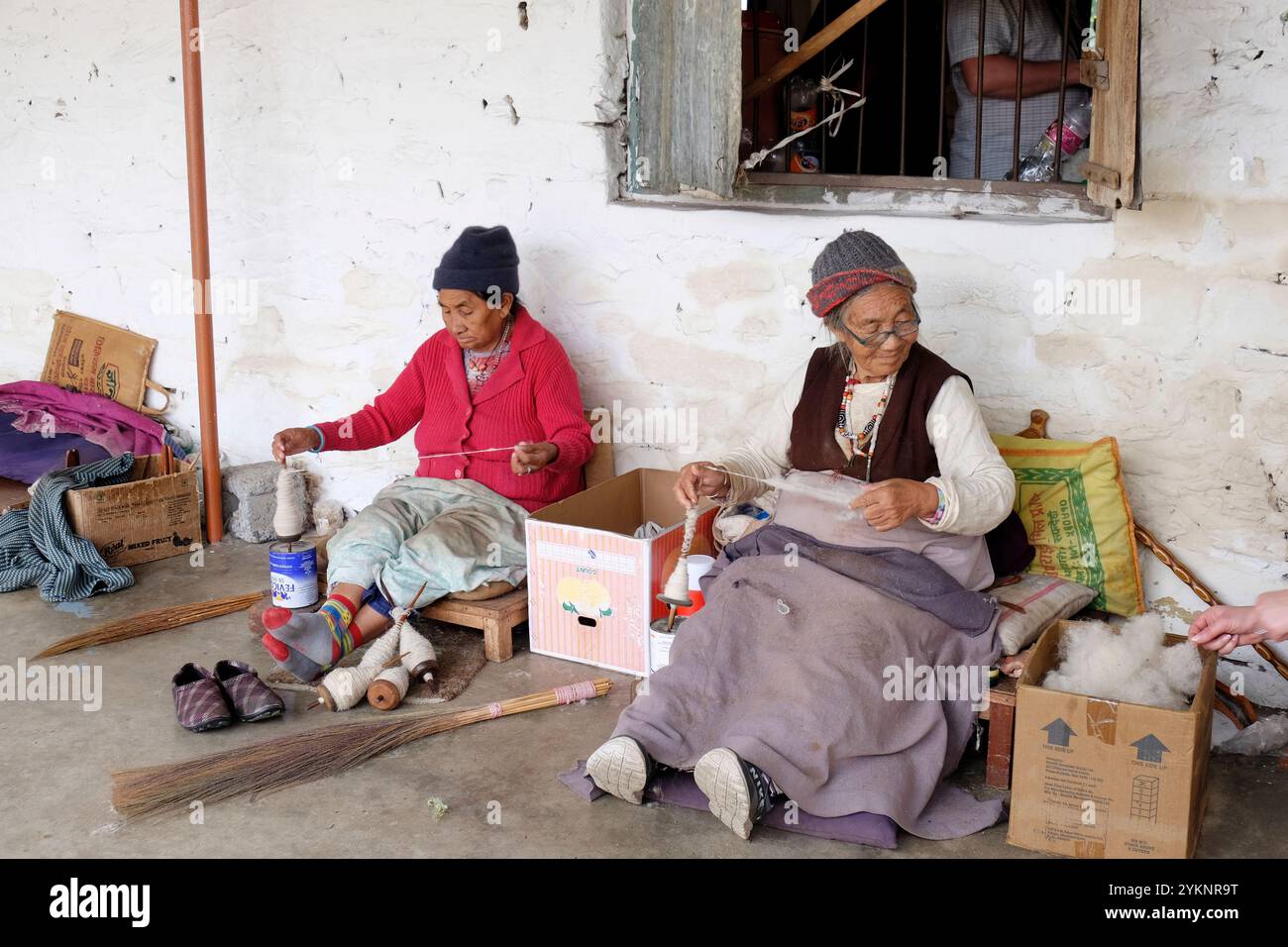 Woman spinning yarn Stock Photo - Alamy