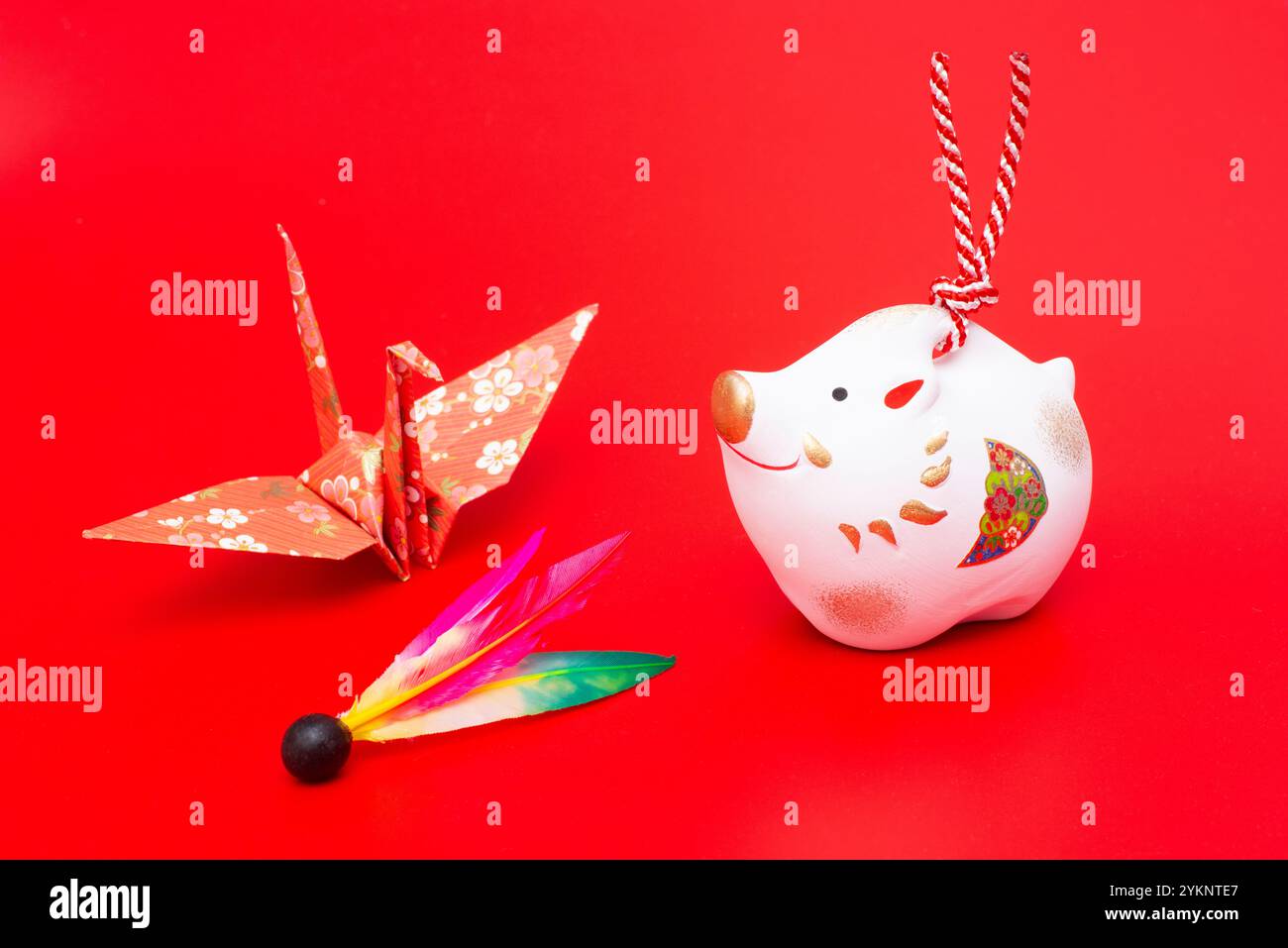 Wild boar figure and feather,Origami crane Stock Photo - Alamy