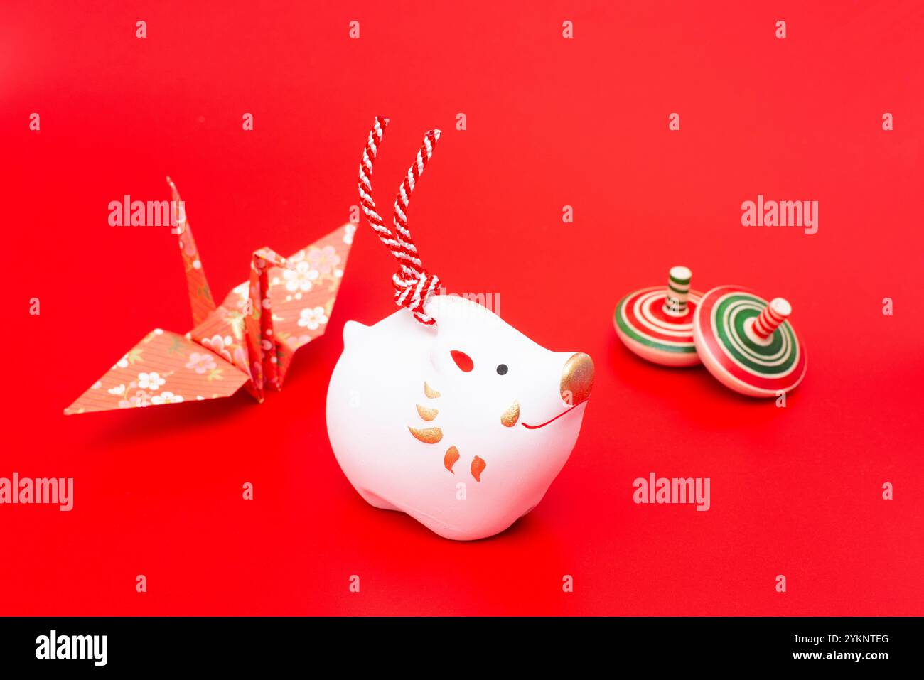 Wild boar figure and spinning top, origami crane Stock Photo - Alamy