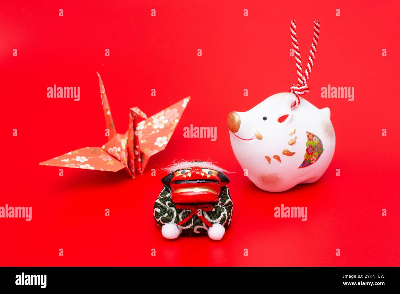 Lion dance, wild boar figures and folded paper cranes Stock Photo - Alamy