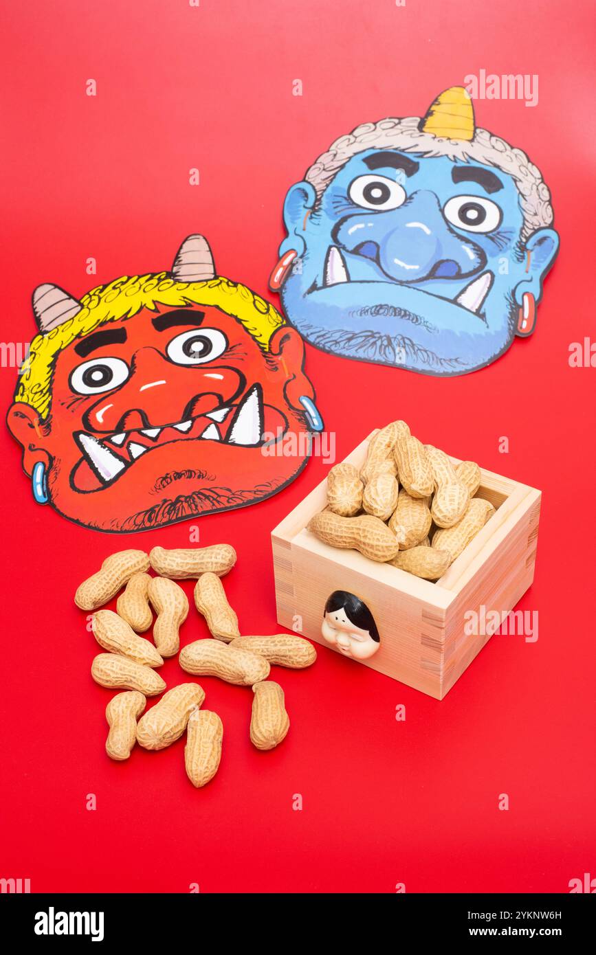 Peanuts in a Masu box with masks of red and blue demons Stock Photo - Alamy