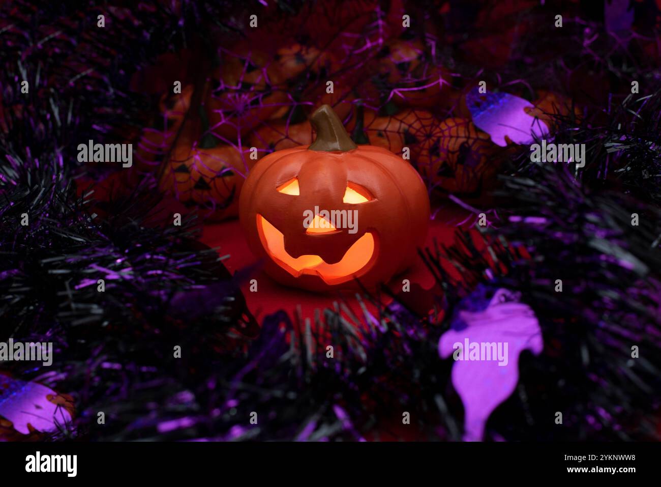 Pumpkin figure and ghost braid, spider web Stock Photo - Alamy