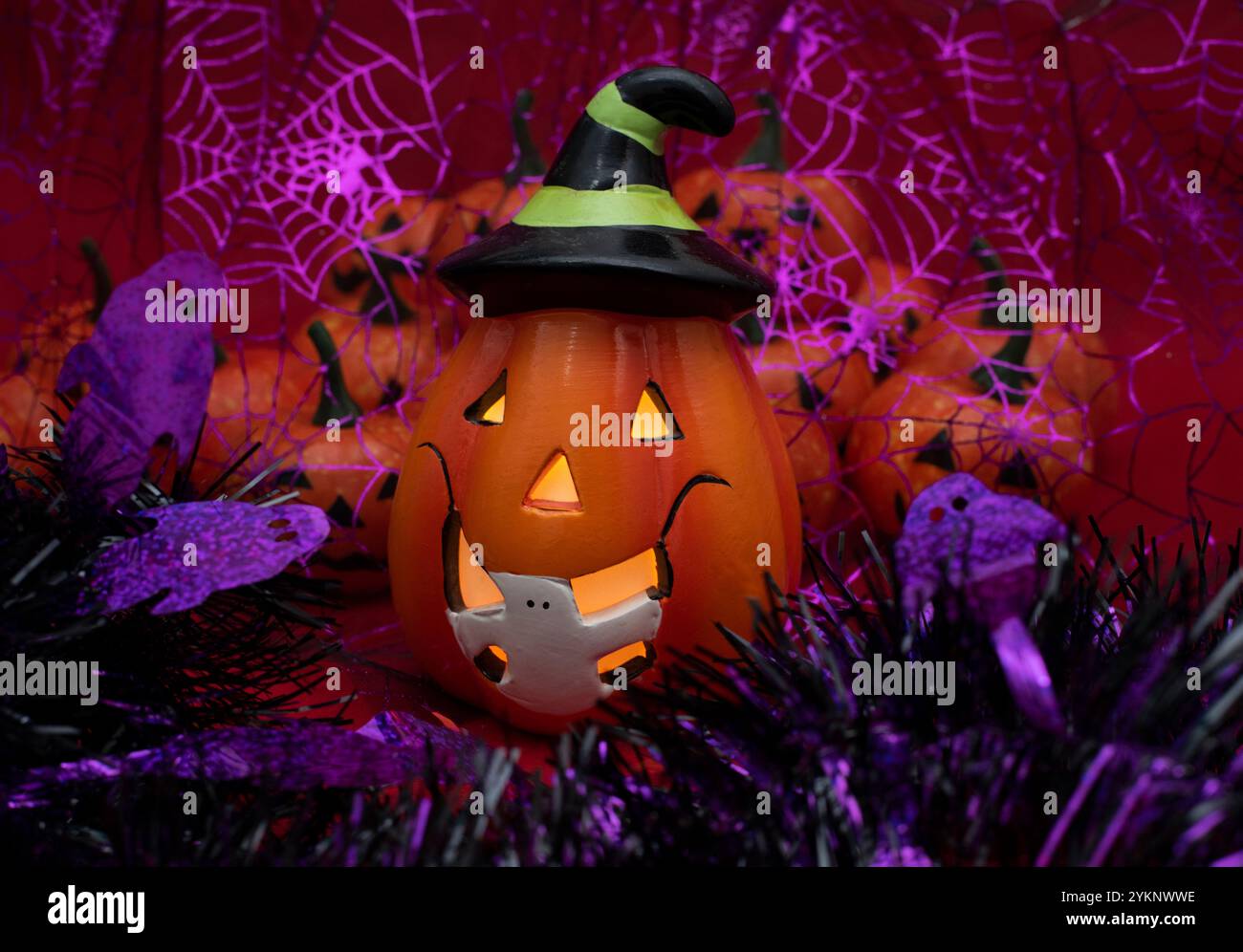 Pumpkin ghost figure and ghost braid, spider web Stock Photo - Alamy