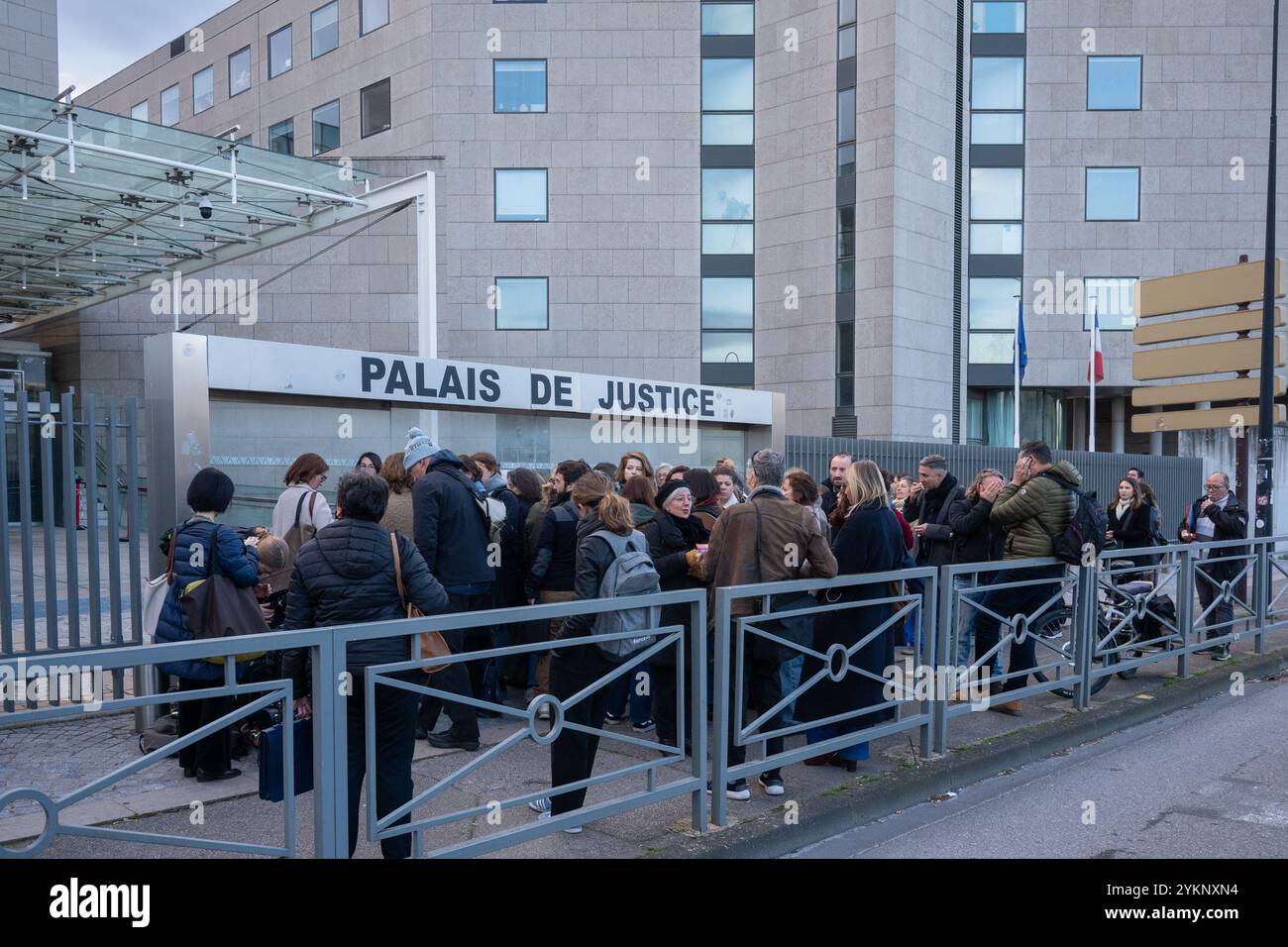 Members of the public arrive at the courthouse for a hearing in the ...