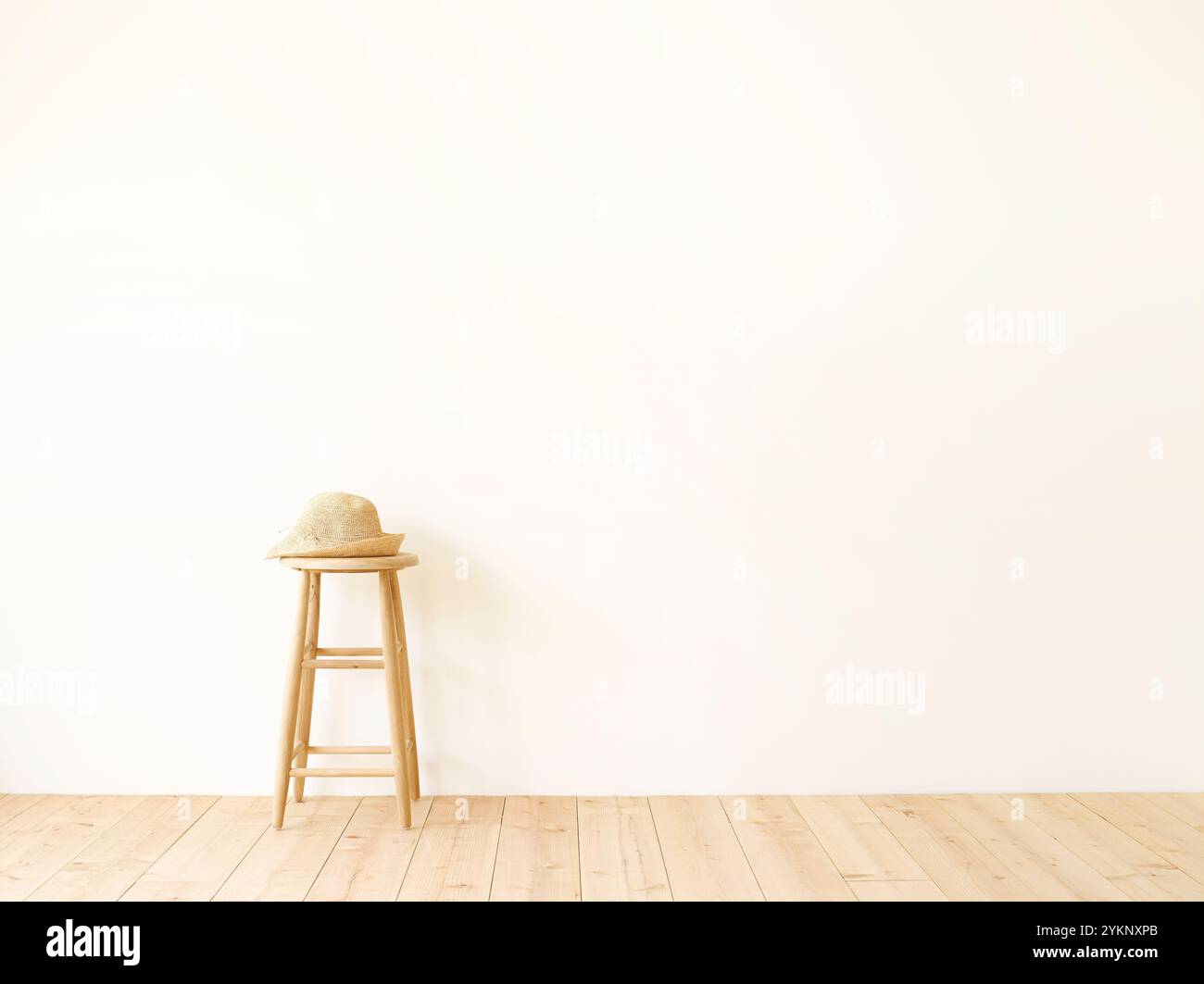Stool, white wall, wooden floor and straw hat Stock Photo - Alamy