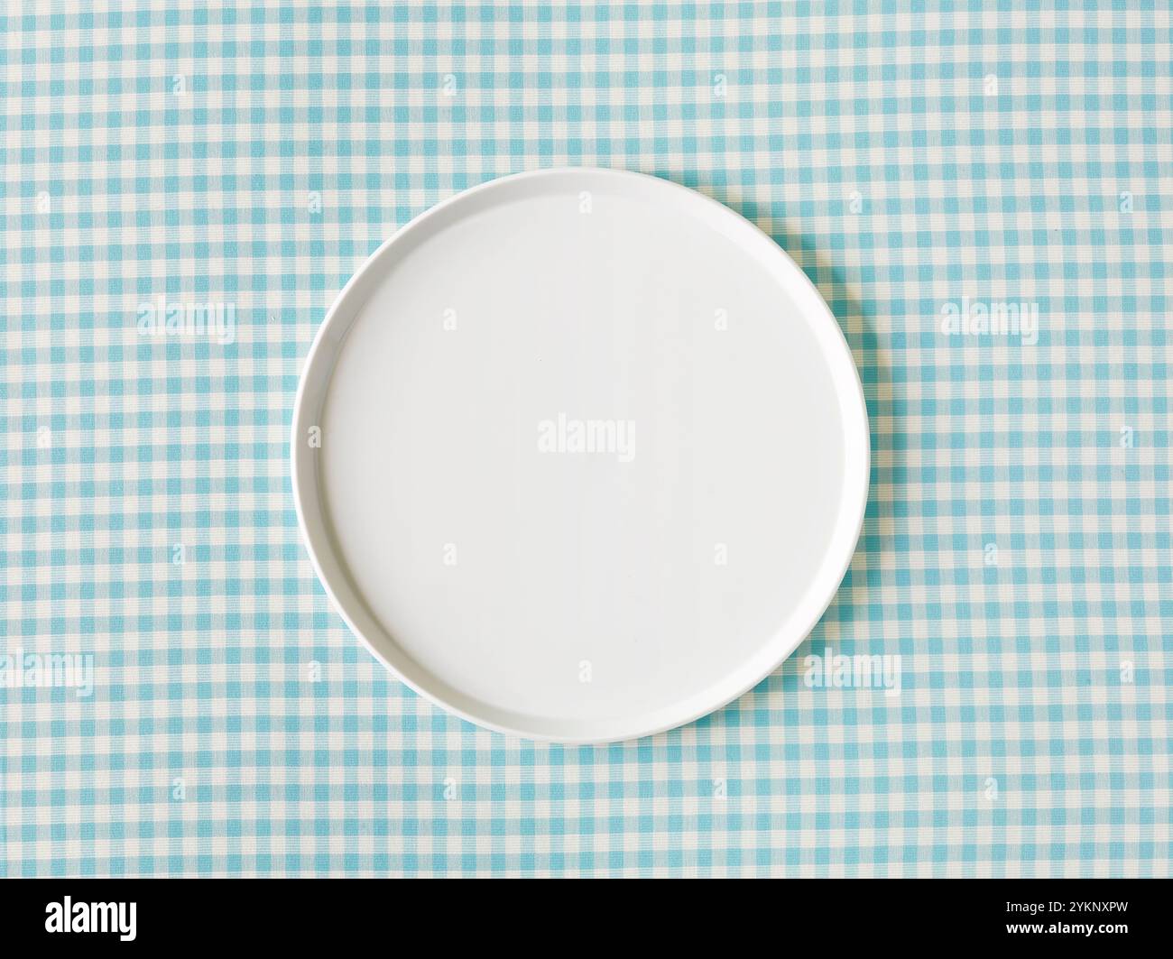 Light blue checked cloth and white dish Stock Photo - Alamy